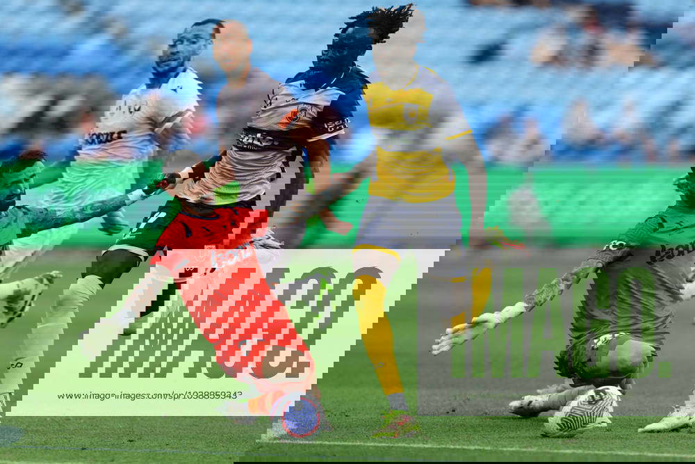 Jing Reec of Central Coast Mariners steps past Paul Izzo of Melbourne ...