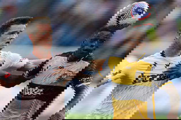 Connor Chapman of Melbourne Victory and Angel Torres of Central Coast ...