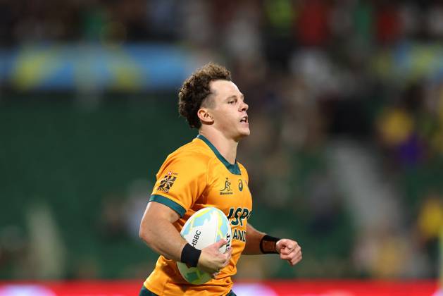 PERTH RUGBY SEVENS, Henry Palmer of Australia is tackled by Morgan ...