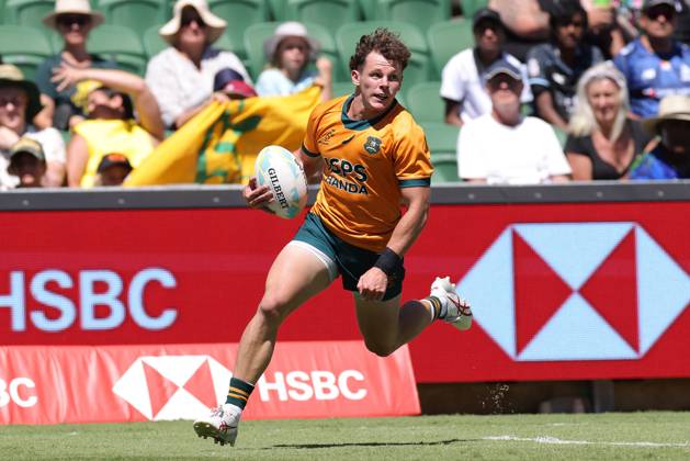 PERTH RUGBY SEVENS, Henry Palmer of Australia is tackled by Morgan ...