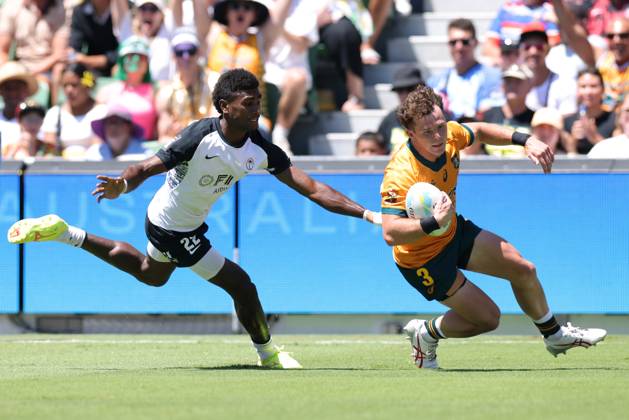 PERTH RUGBY SEVENS, Henry Palmer of Australia is tackled by Morgan ...