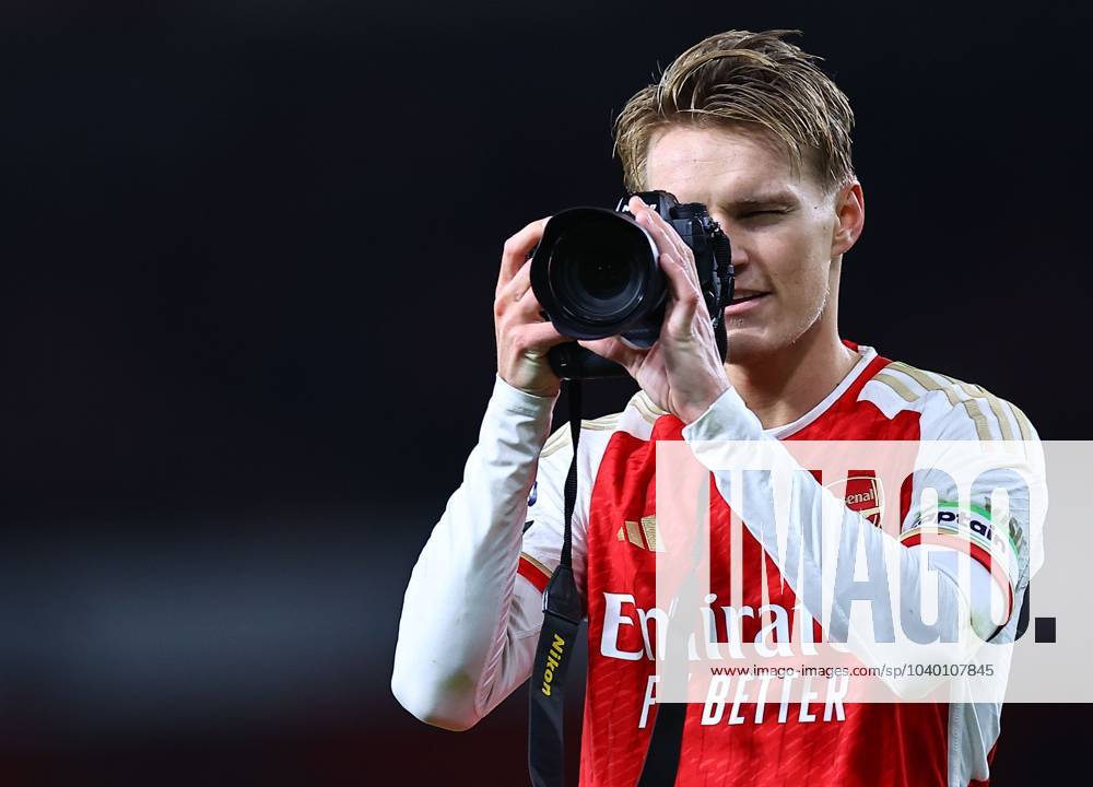 Martin Odegaard of Arsenal takes pictures by Nikon camera after the ...