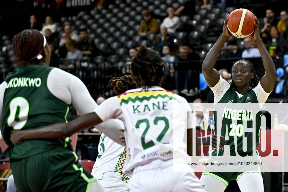 Senegalese Ndioma Kane and Nigerian Murjanatu Musa pictured in action during a basketball match