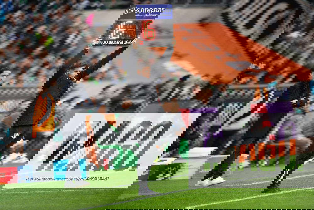 The fourth official indicates injury time, 16 minutes, injury time, due ...