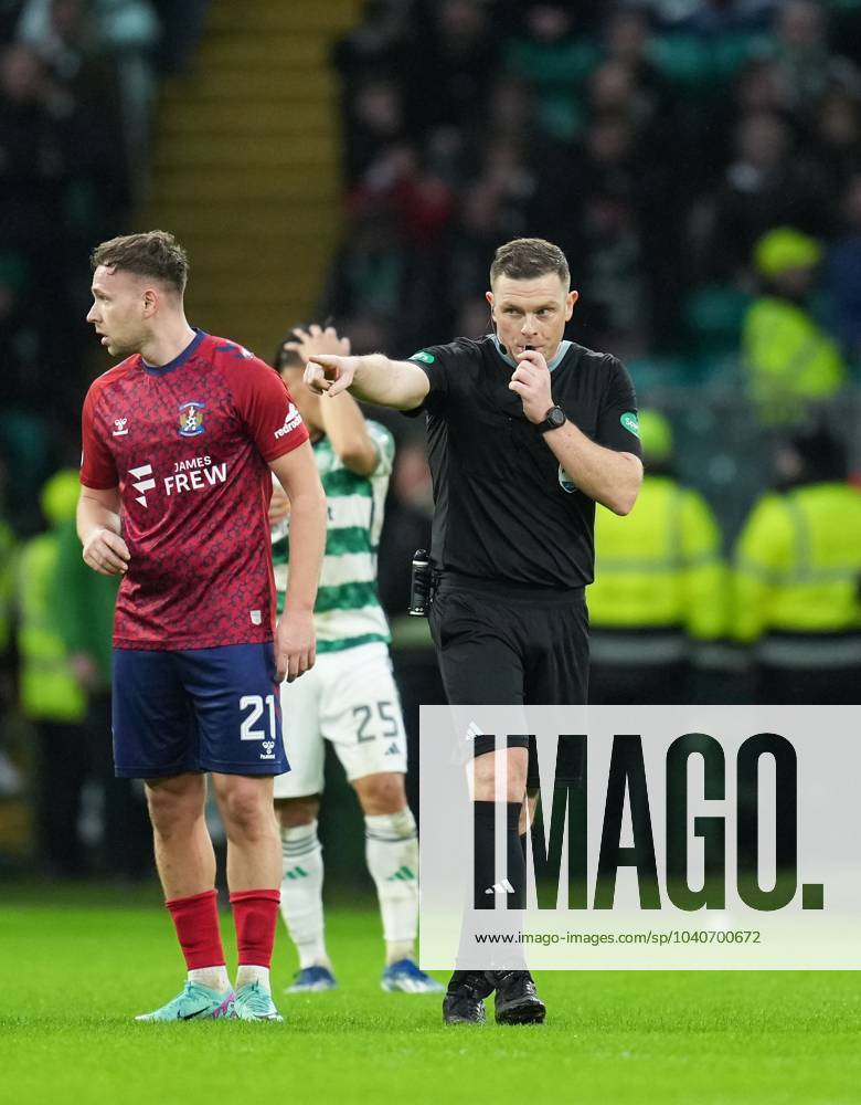Referee John Beaton points to the centre spot as he awards a goal ...