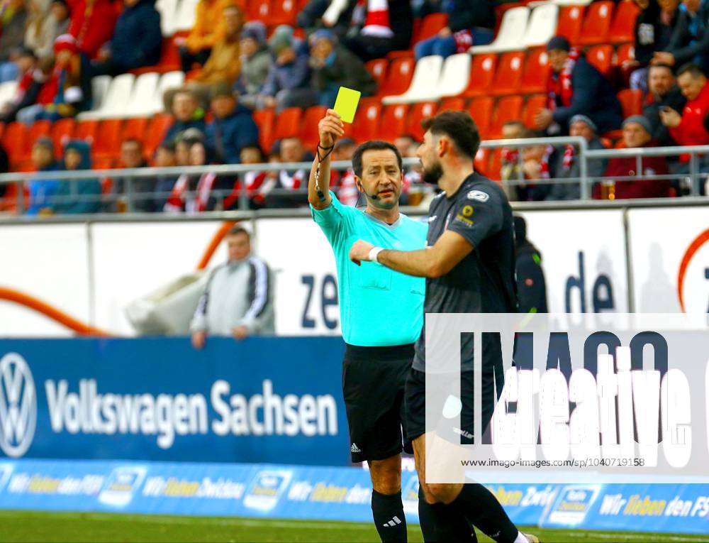 Referee Patrick Kluge Zeitz shows the yellow card for Lucas Zeller ...