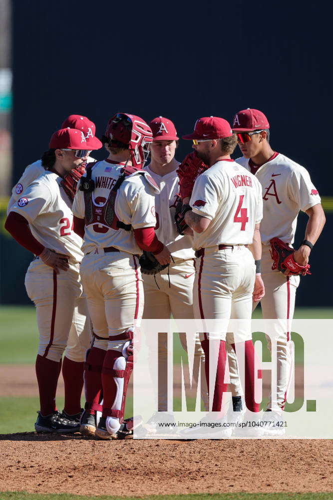 February 18, 2024: The Razorback infield gather around pitcher Gabe Gaeckle 20 and first baseman