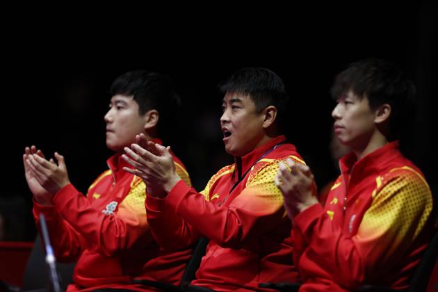 BUSAN, Feb. 22, 2024 -- Players and coach Wang Hao of China react during the men s team