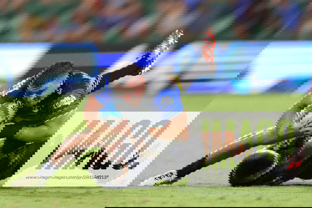 SUPER RUGBY FORCE HURRICANES, Sam Spink of the Force is tackled by ...