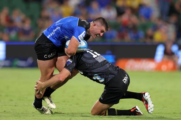 SUPER RUGBY FORCE HURRICANES, Sam Spink of the Force is tackled by ...