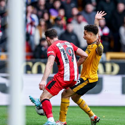 Sheffield s Jack Robinson & Wolves Joao Gomes battle for possession in ...