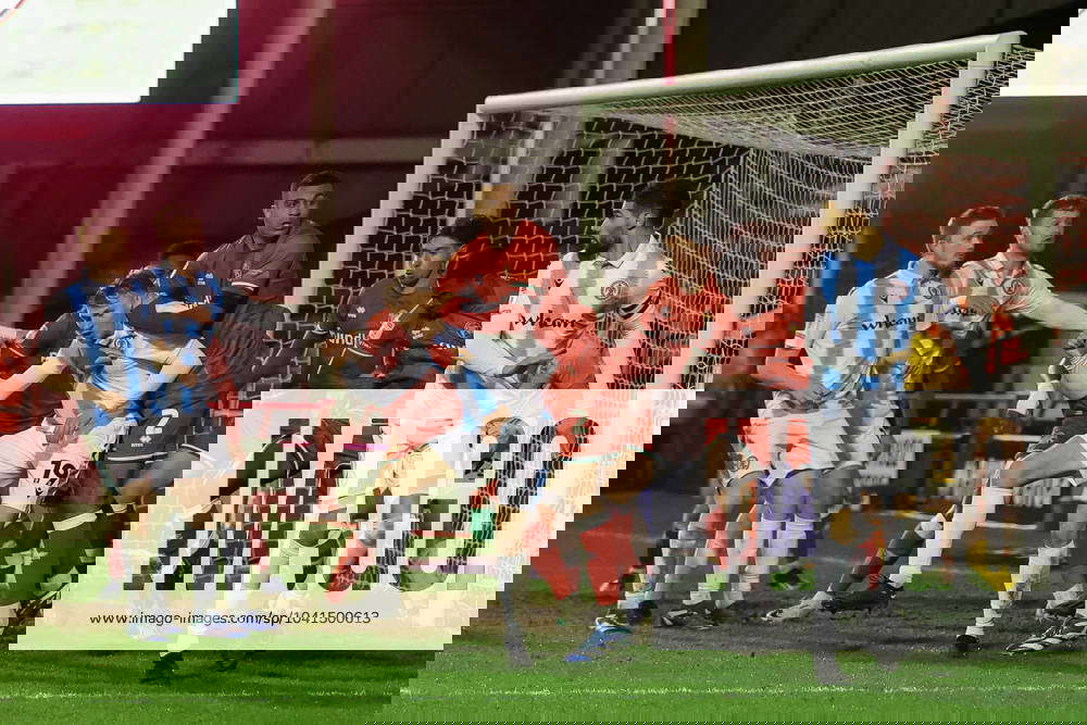 Accrington s Jake Bickerstaff & Walsall s David Okagbue battle in the ...