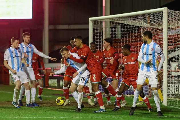 Accrington s Jake Bickerstaff & Walsall s David Okagbue battle in the ...