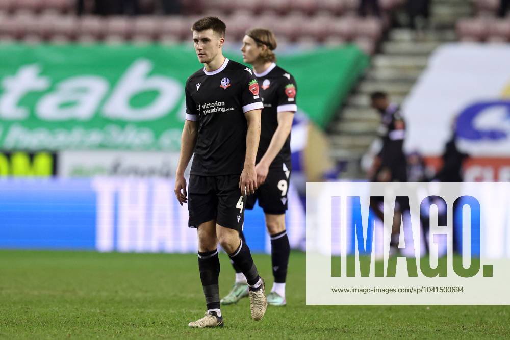 George Thomason of Bolton Wanderers looks dejected on the final whistle ...