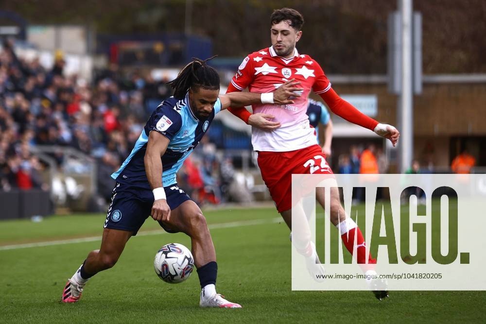 Garath McCleary of Wycombe holds off pressure from Corey O Keefe of ...