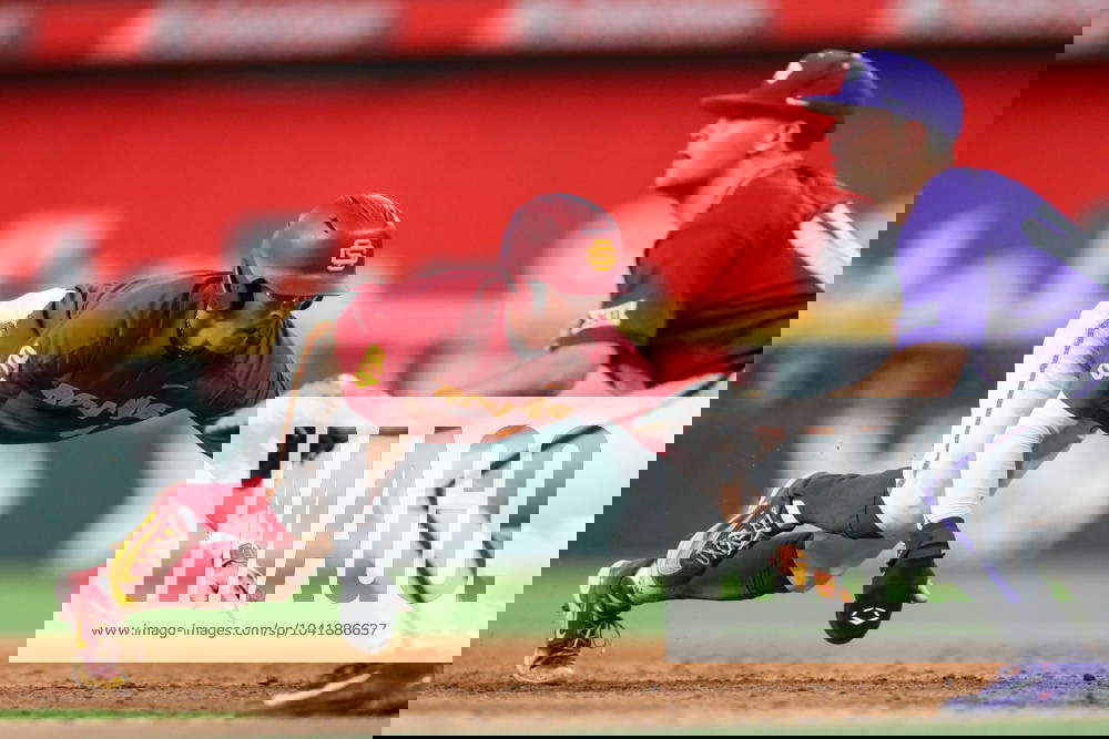 Arlington, Texas, USA: USC s CARSON WELLS attempts to avoid a pickoff ...