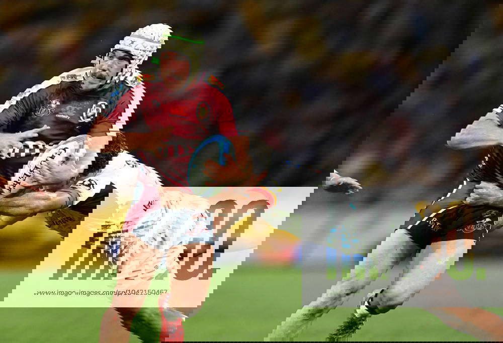 SUPER RUGBY REDS CHIEFS, Mac Grealy (left) of the Reds takes on Liam ...