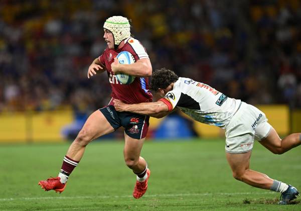 SUPER RUGBY REDS CHIEFS, Mac Grealy (left) of the Reds takes on Liam ...