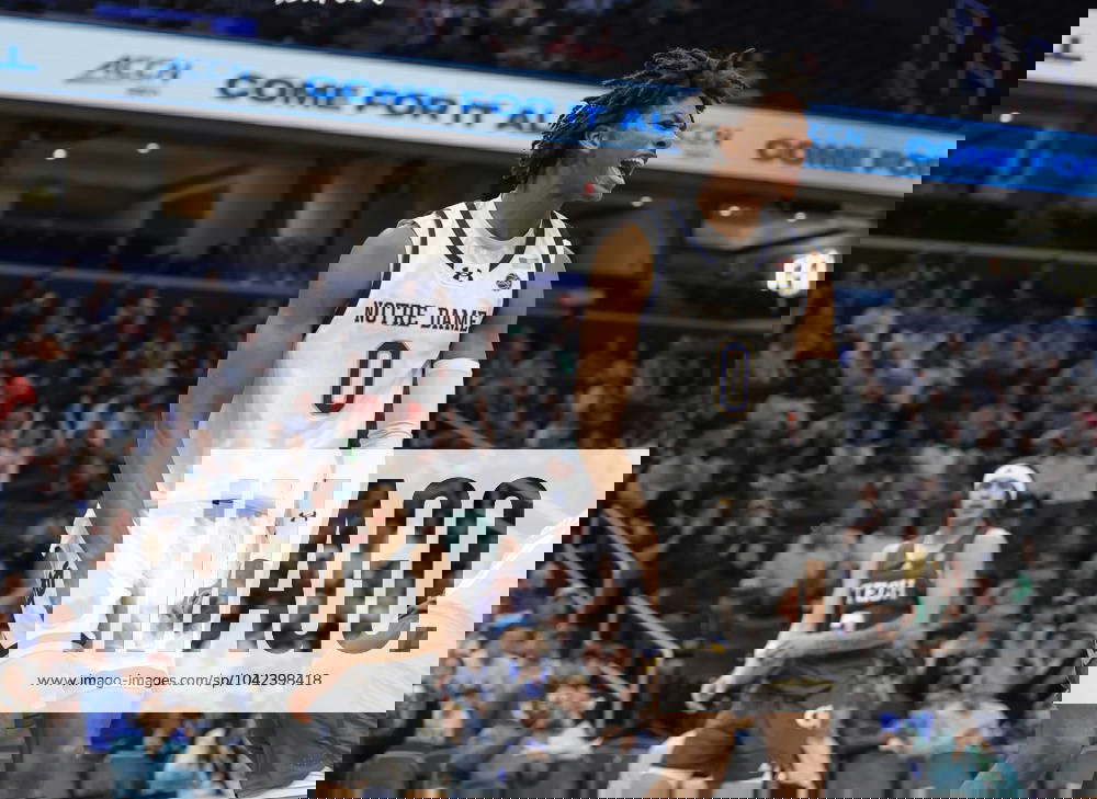 : Notre Dame Fighting Irish Forward Carey Booth celebrates a basket ...