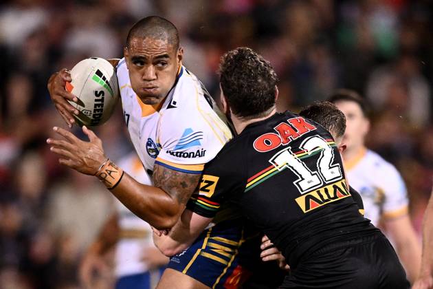 NRL PANTHERS EELS, Joe Ofahengaue of the Eels is tackled by Liam Martin ...