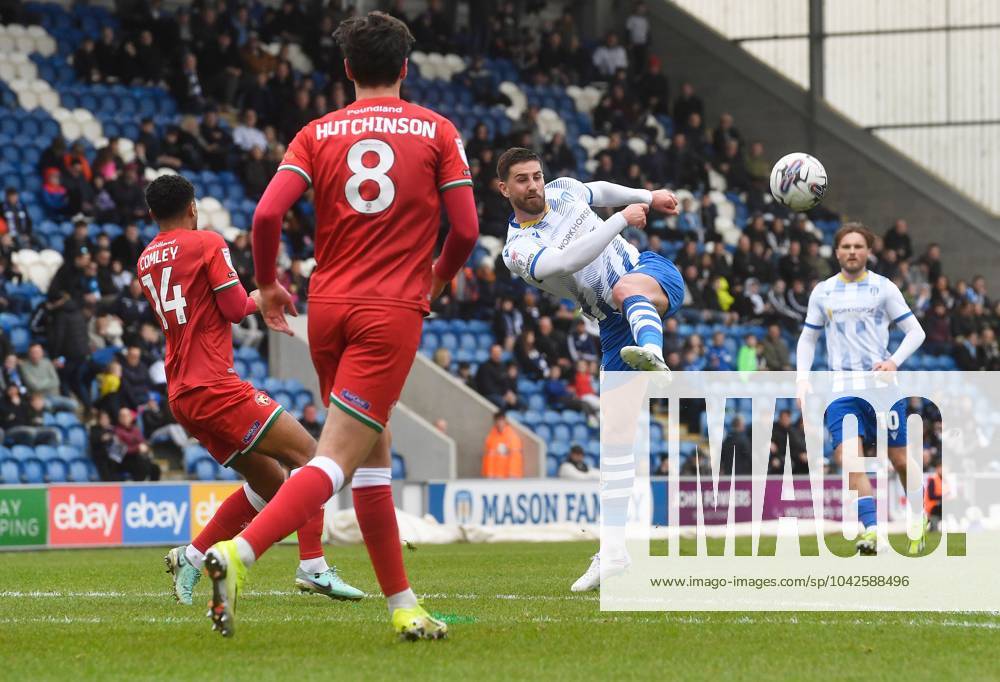 Tom Dallison of Colchester United has his shot blocked by Brandon ...
