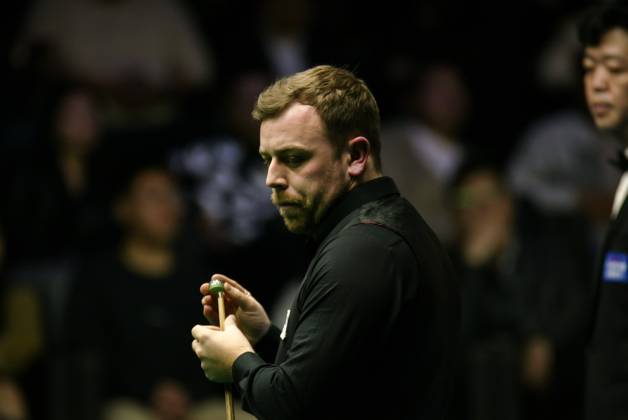 SHANGRAO, CHINA - MARCH 19: Oliver Brown of England chalks the cue in ...