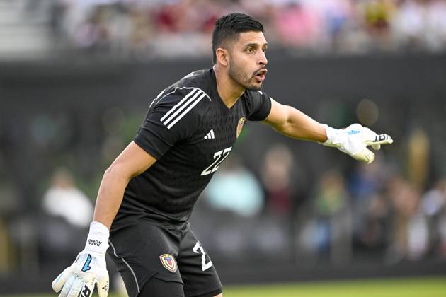 FT. LAUDERDALE, FL - MARCH 21: Venezuela goaltender Rafael Romo walks ...