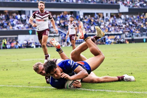 NRL EELS SEA EAGLES, Blaize Talagi of the Eels celebrates a try with ...