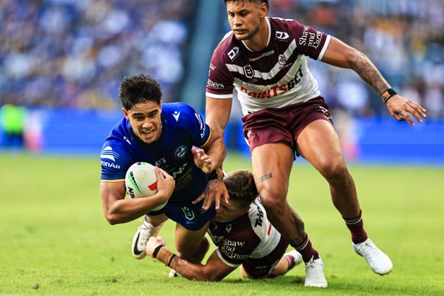 NRL EELS SEA EAGLES, Blaize Talagi of the Eels celebrates a try with ...