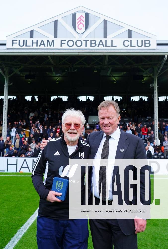 Fulham Director David Daly presents the Reverend Gary Piper with a ...