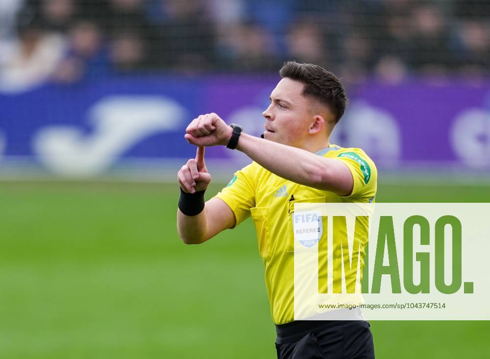 Referee Matthew MacDermid points to the penalty spot after a VAR check ...