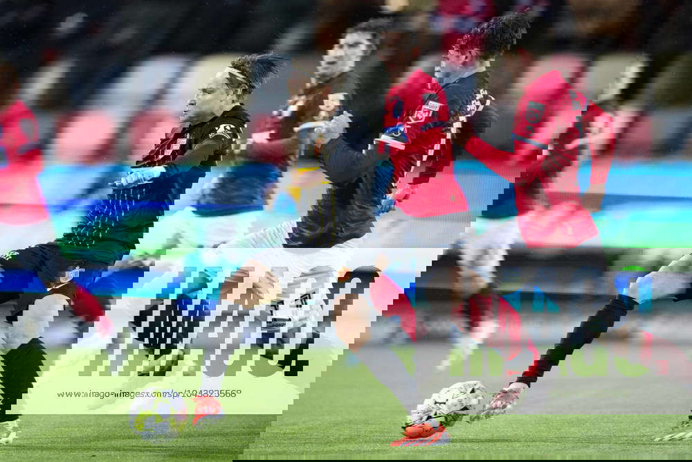 Andreas Schjelderup, FC Nordsjaelland running with Silkeborg s Callum ...