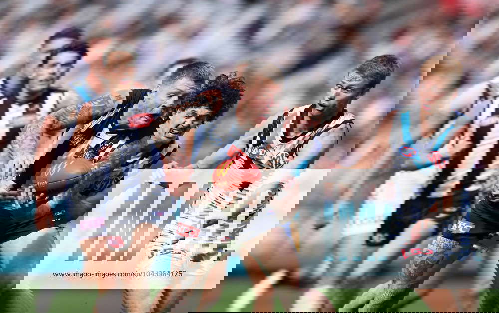 AFL MAGPIES POWER, Jordan De Goey of Collingwood (centre) handballs the ...