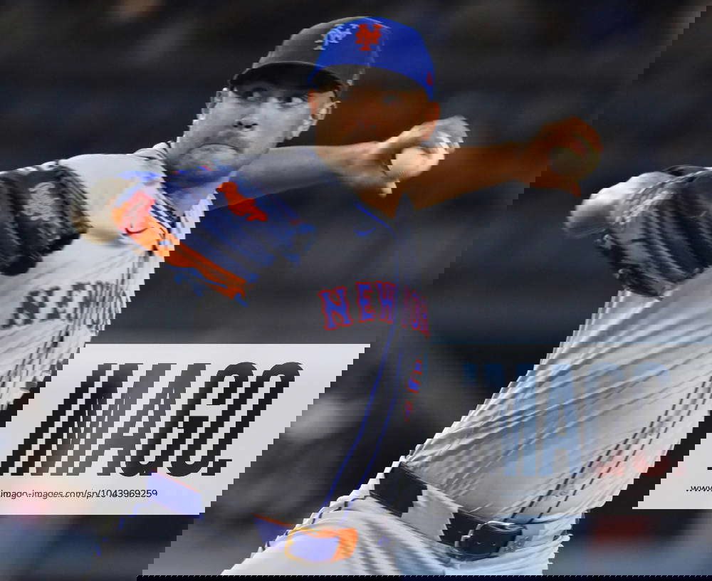 New York Mets starting pitcher Sean Mainea winds up to deliver against ...