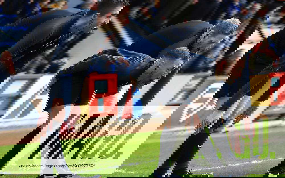 Referee Paul Howard (C) Assistant Referee Kevin Howick (R) and ...