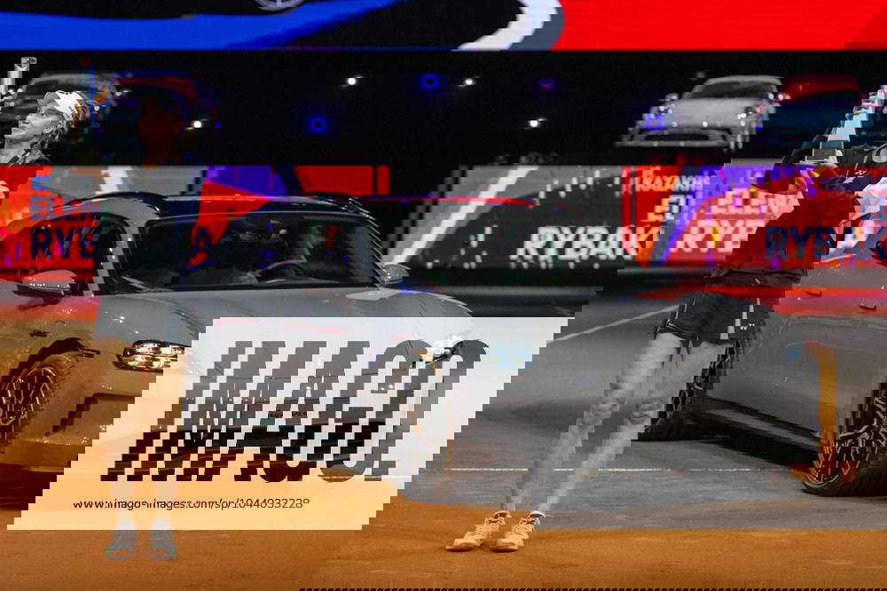 The winner Elena Rybakina KAZ with her trophy and the Porsche Taycan 4S ...