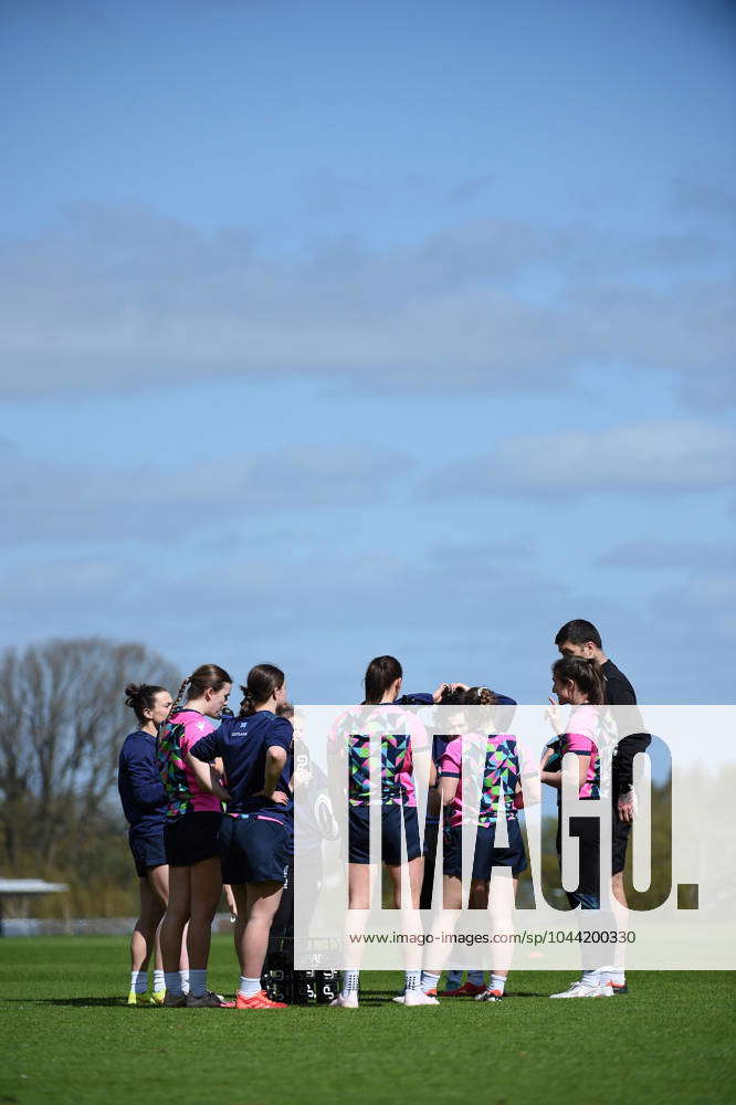 Scotland backs gather into a huddle during the training seession ...