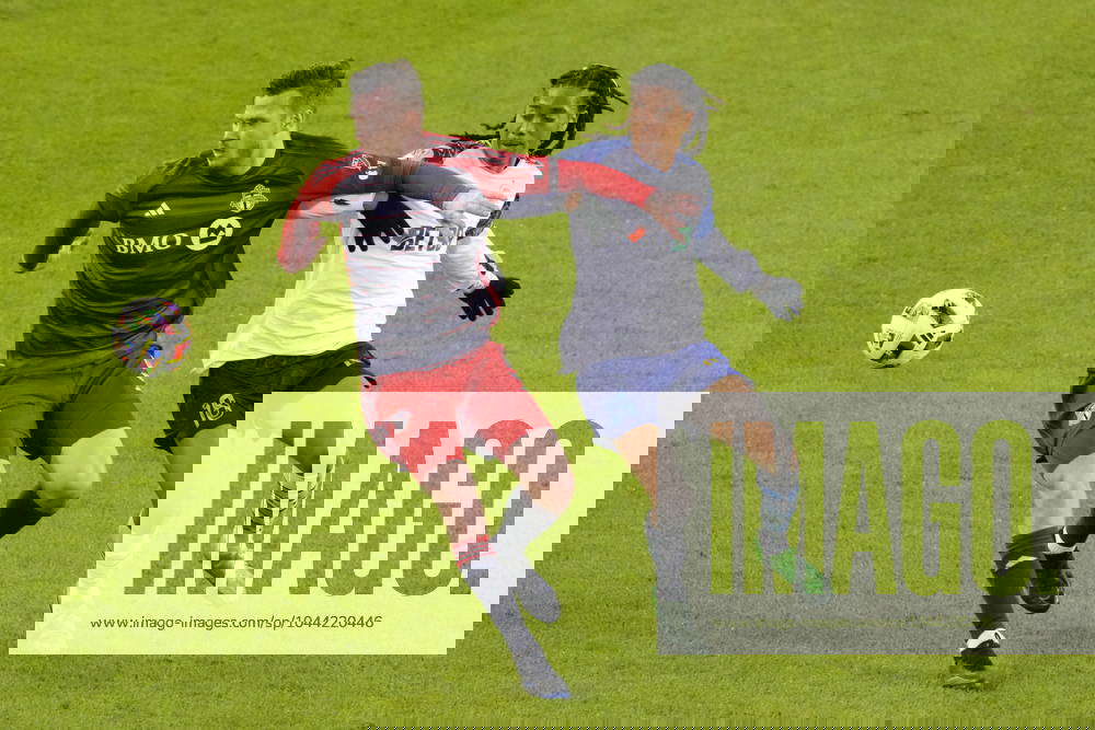 Toronto, On, Canada: Toronto FC s Kevin Long, left, holds off Simcoe ...