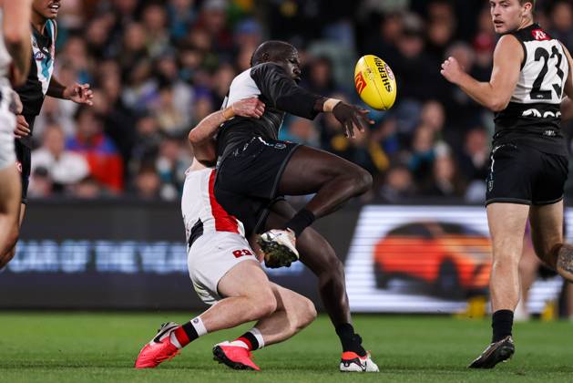 AFL POWER SAINTS, Aliir Aliir of the Power is tackled by Cooper Sharman ...