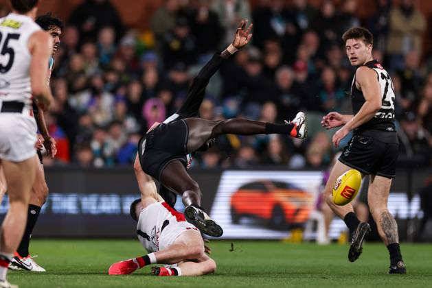 AFL POWER SAINTS, Aliir Aliir of the Power is tackled by Cooper Sharman ...