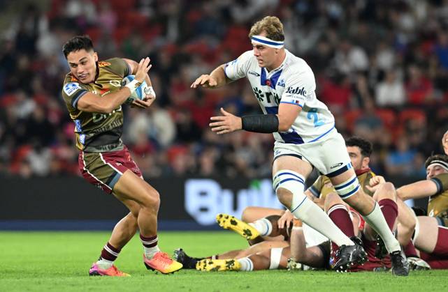 SUPER RUGBY REDS BLUES, Kalani Thomas (left) of the Reds in action ...