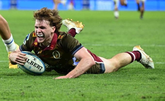 SUPER RUGBY REDS BLUES, Tim Ryan of the Reds celebrates scoring a try ...