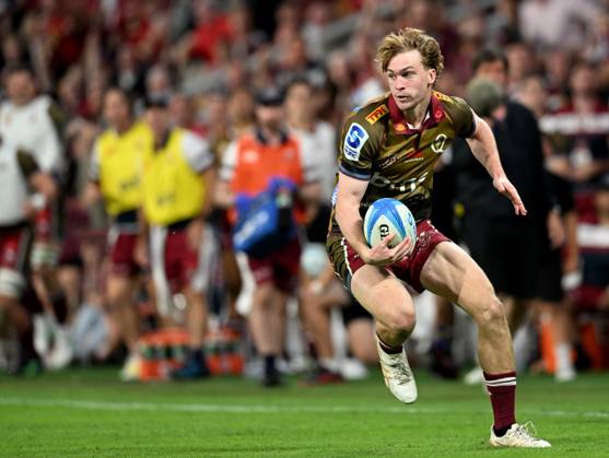 SUPER RUGBY REDS BLUES, Tim Ryan of the Reds celebrates scoring a try ...