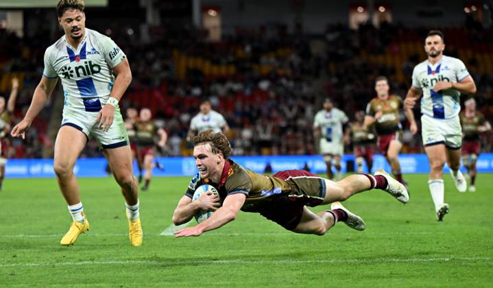SUPER RUGBY REDS BLUES, Tim Ryan of the Reds celebrates scoring a try ...