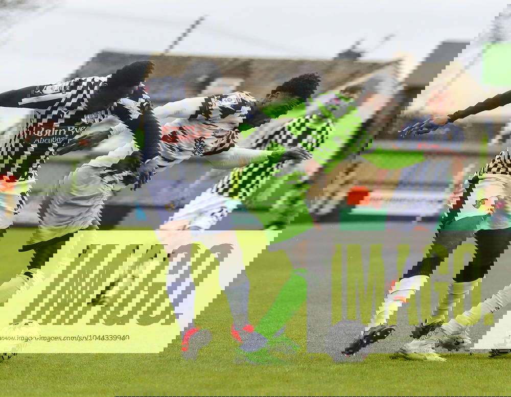 Aaron Nemane of Notts County vies for the ball with Jordan Garrick of ...