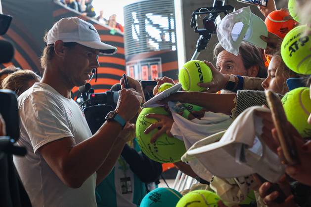 Rafael Nadal of Spain seen signing autographs for his fans in Usera ...