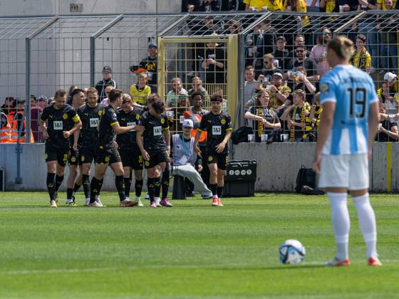 Dortmund players celebrate with Ole Pohlmann BV Borussia Dortmund U23 ...