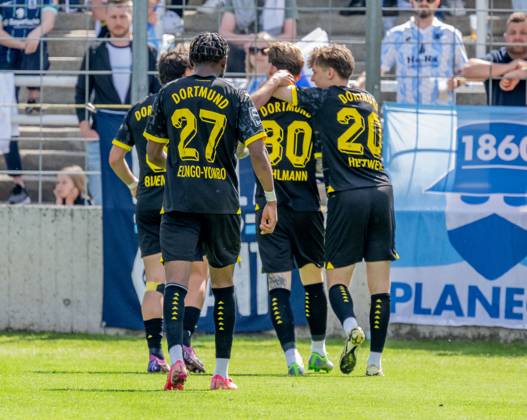 Dortmund players celebrate with Ole Pohlmann BV Borussia Dortmund U23 ...