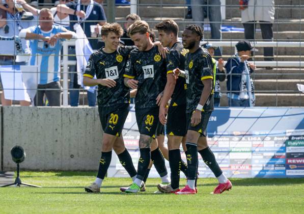 Dortmund players celebrate with Ole Pohlmann BV Borussia Dortmund U23 ...