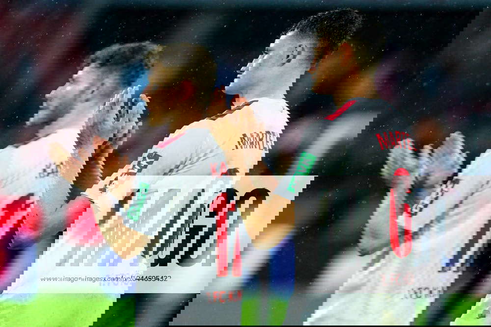 Leart Pacarada 1 FC Koeln, 17 and Eric Martel 1 FC Koeln, 06 thank the ...